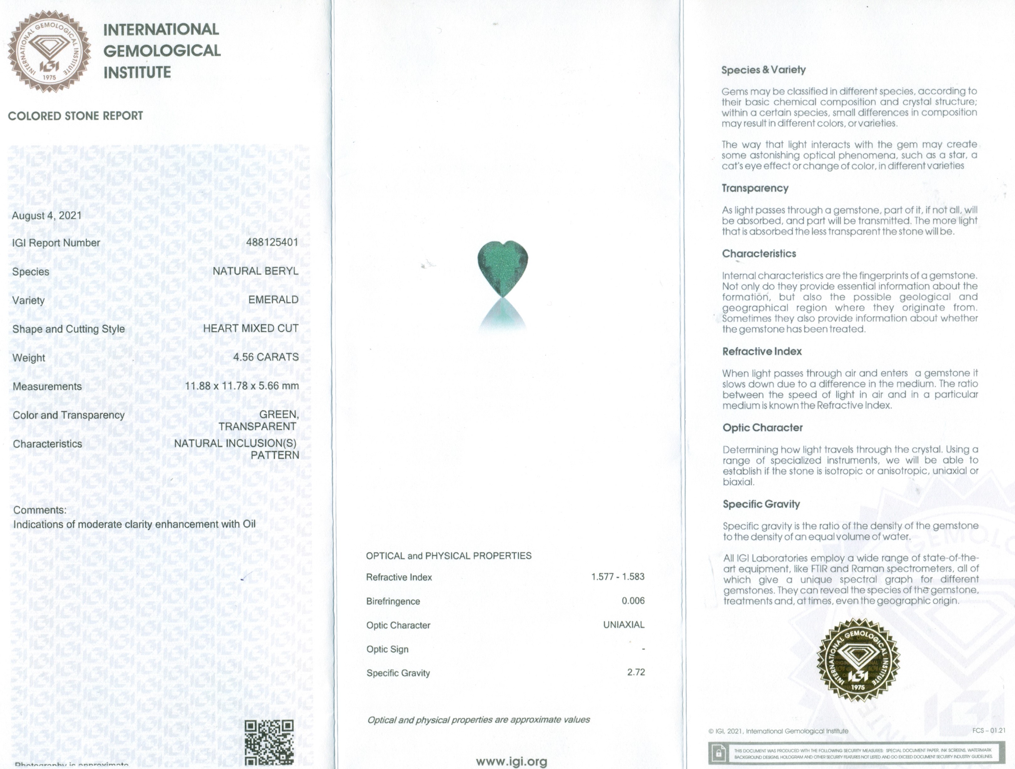 Anello in oro bianco a forma di cuore con smeraldo verde vivo ...